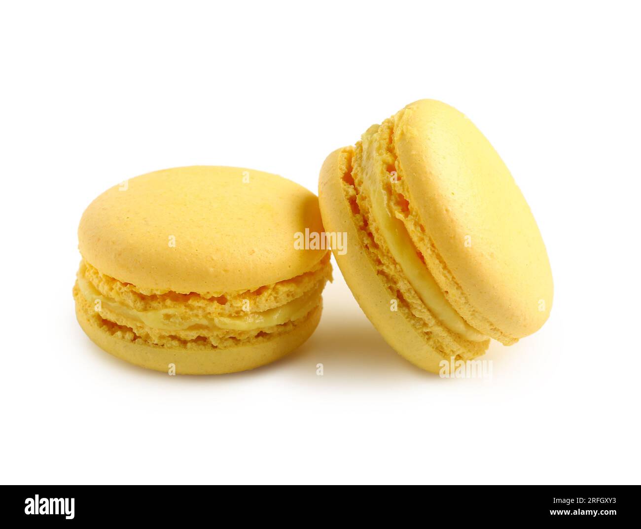 Sweet yellow macaroons on white background Stock Photo - Alamy