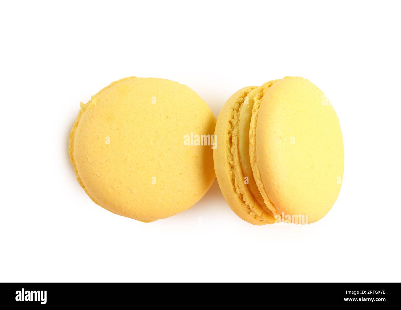 Sweet yellow macaroons on white background Stock Photo - Alamy
