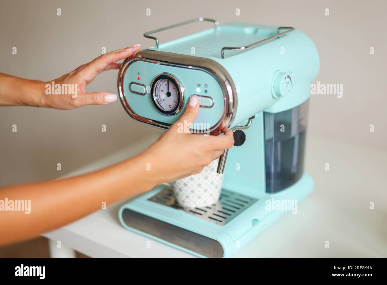 Making coffee. Barista pushing button Start on a coffee machine Stock ...