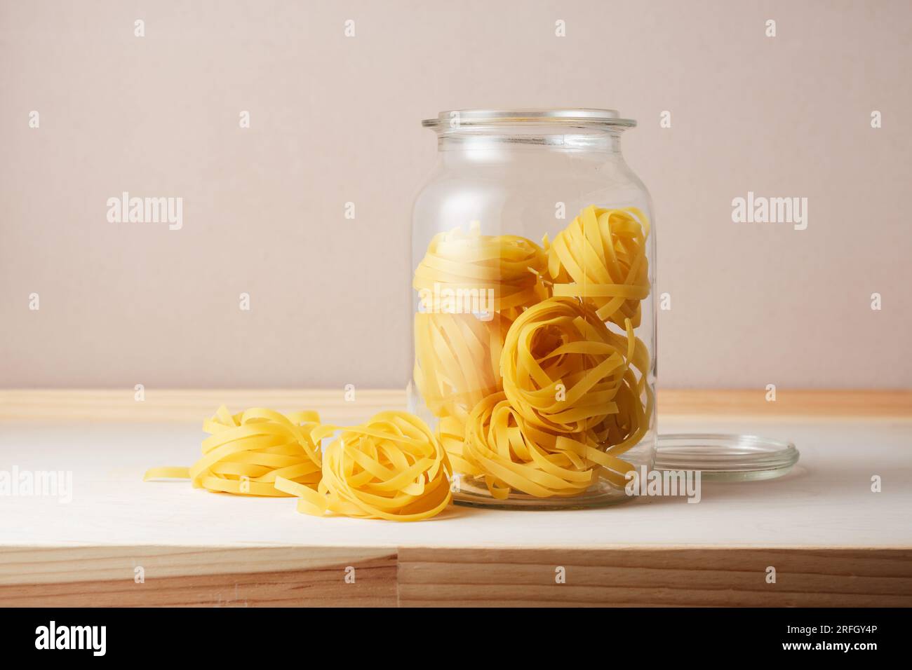 Uncooked tagliatelle pasta in hi-res stock photography and images - Alamy