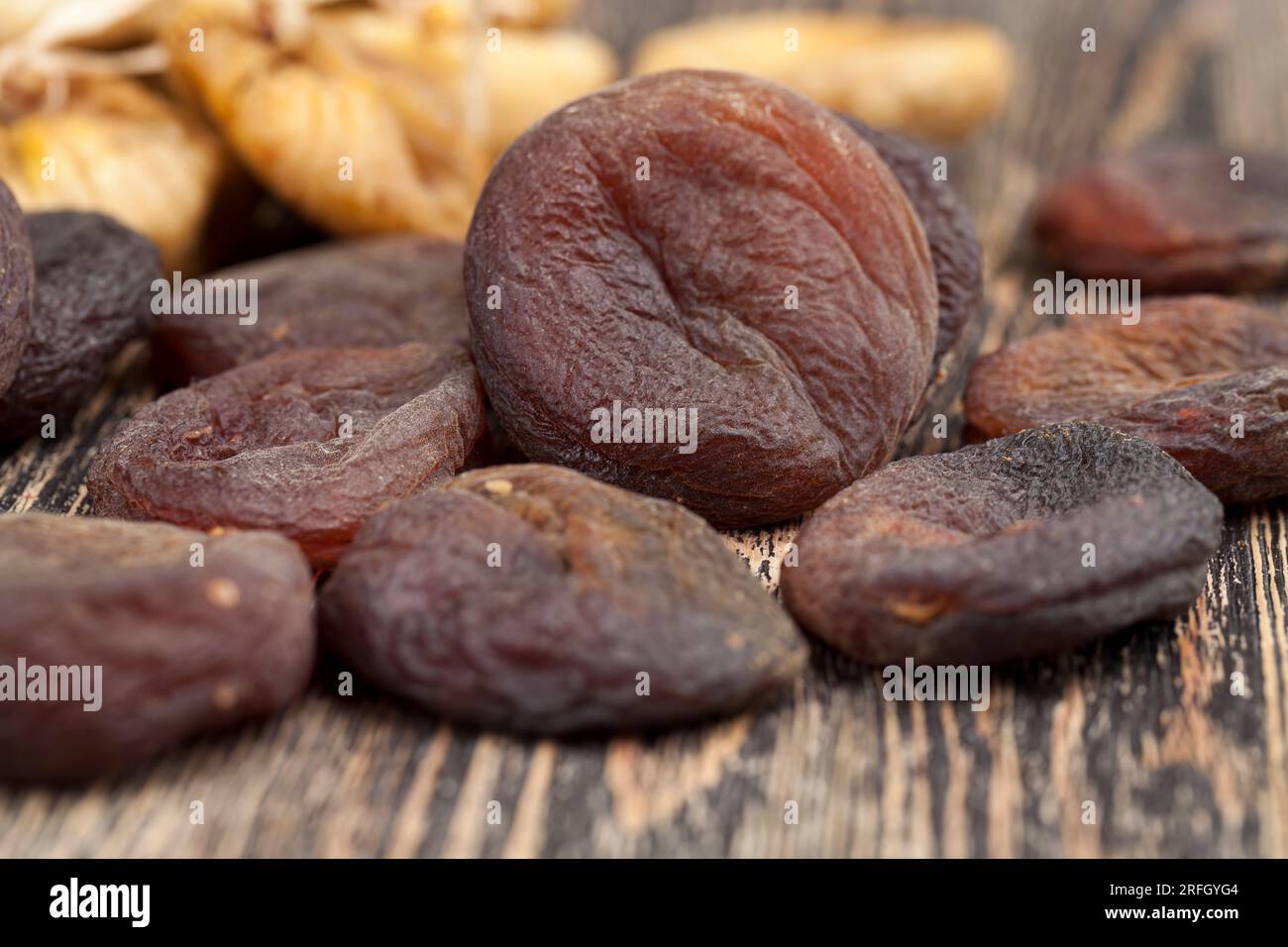 dark dried apricots of large size, dried apricots in sunlight with ...