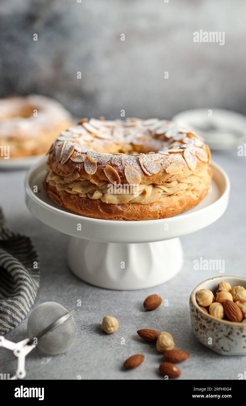 Round-shaped classic French dessert Paris Brest with almonds and ...
