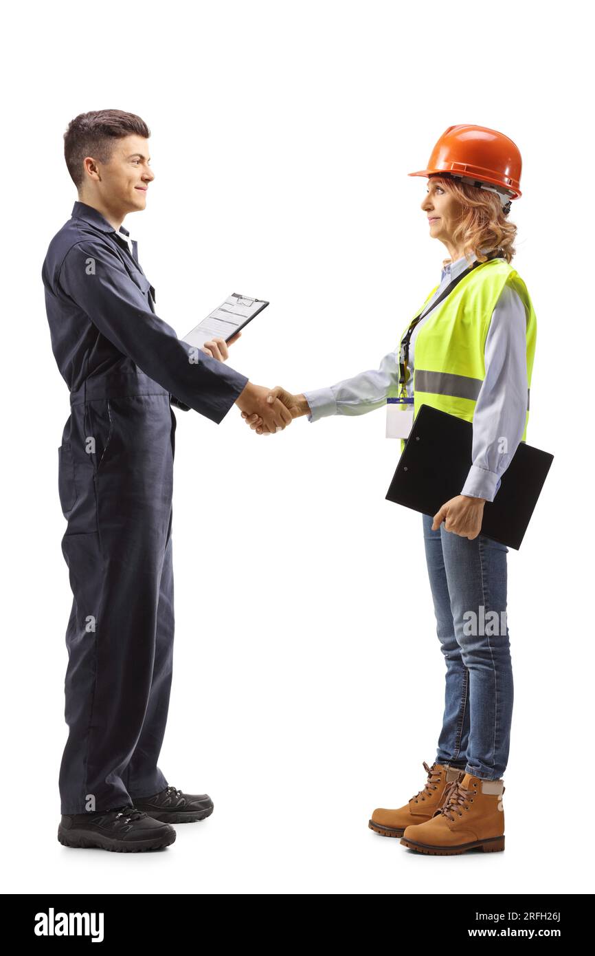 Full length profile shot of a worker shaking hand with a female ...