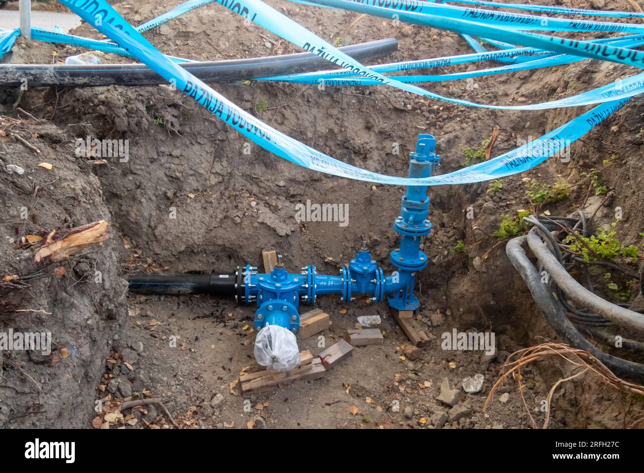 Water pipes on the street Stock Photo - Alamy
