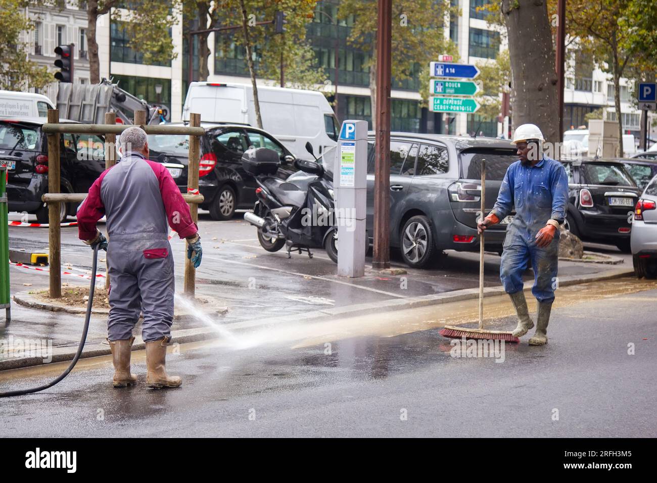 Paris, France - September 25, 2017: street cleaning by construction ...