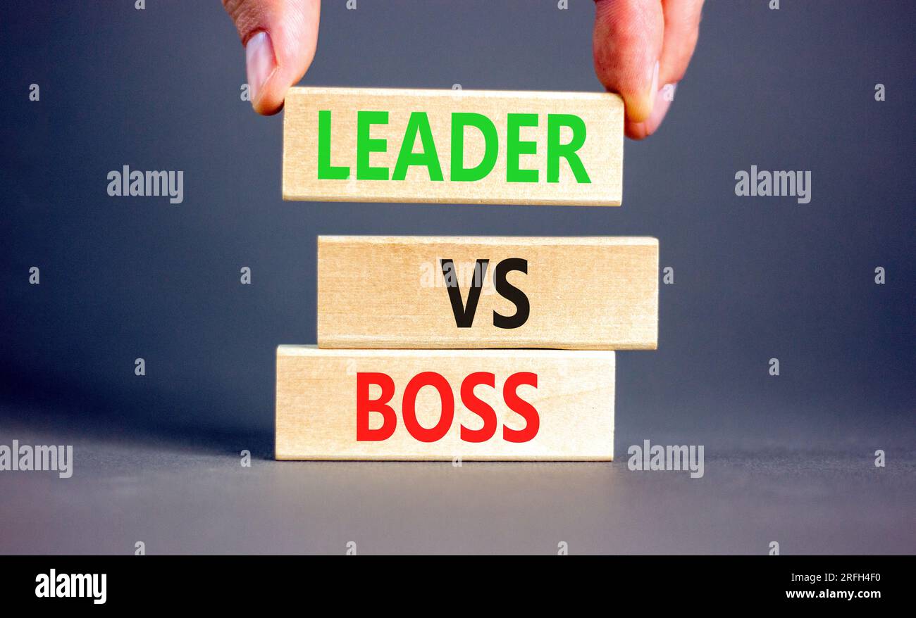 Boss vs leader symbol. Concept words Boss vs versus leader on wooden ...