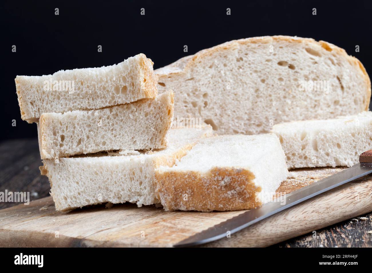 sliced pieces of gray bread from second rate low quality flour, bread ...