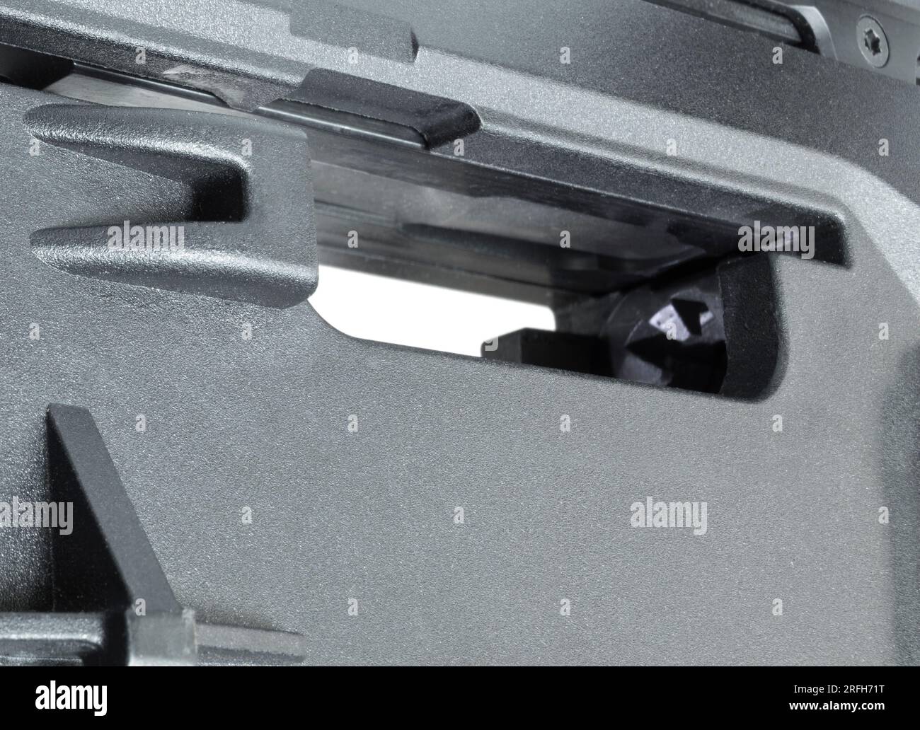 Bolt held open on an assault rifle to show that there is no cartridge ...