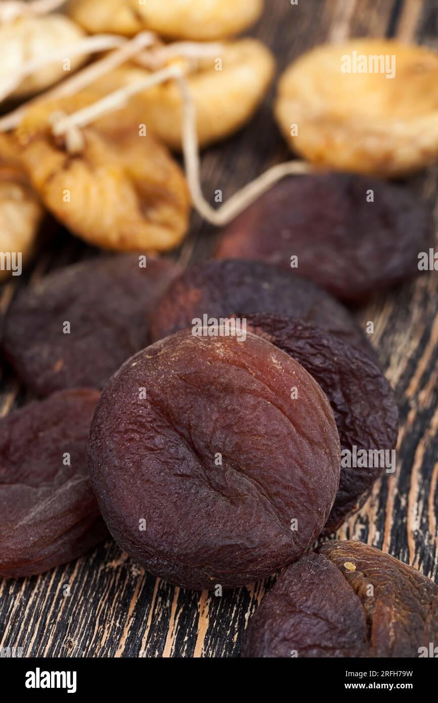 dark dried apricots of large size, dried apricots in sunlight with ...