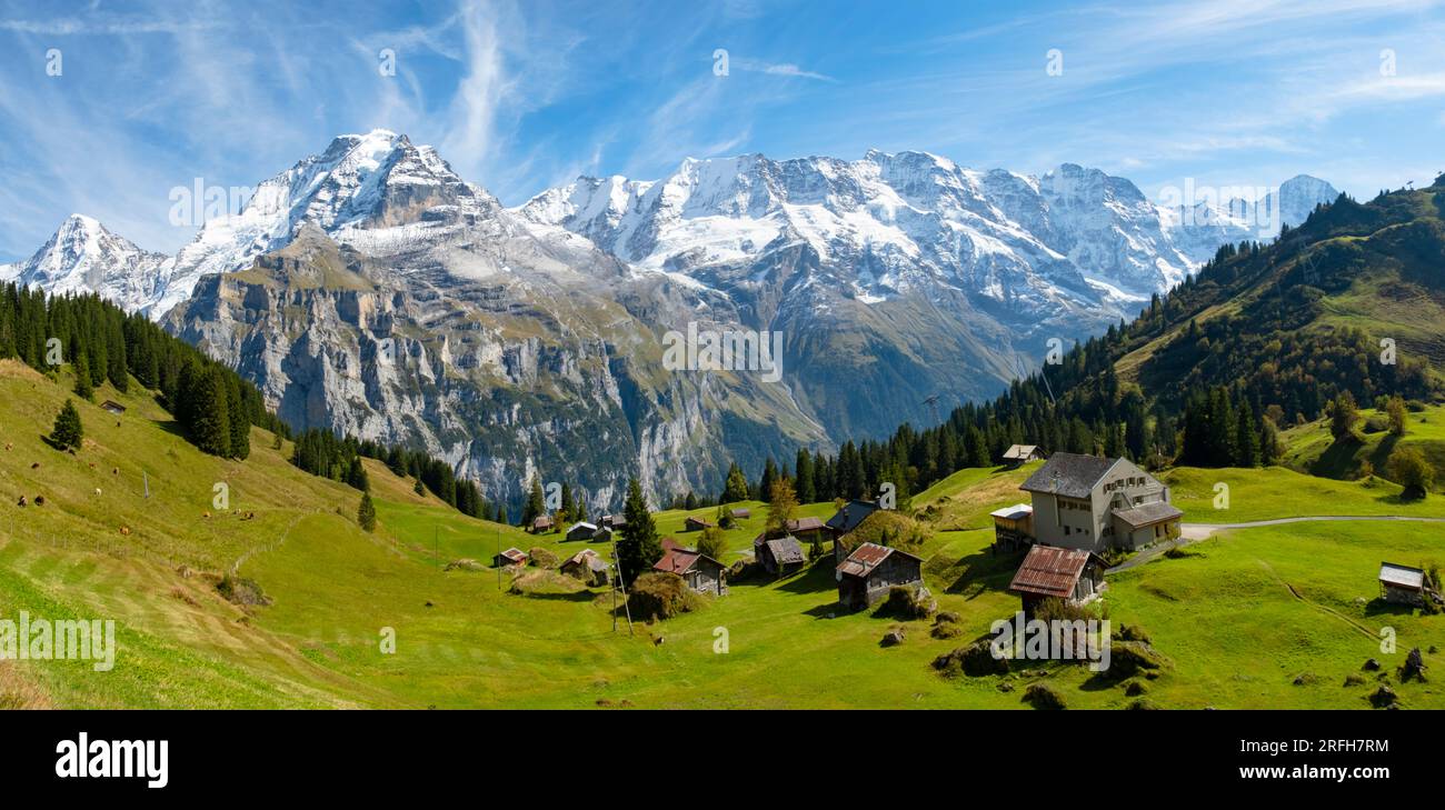 Traditional alpine village in touristic valley Lauterbrunnen ...
