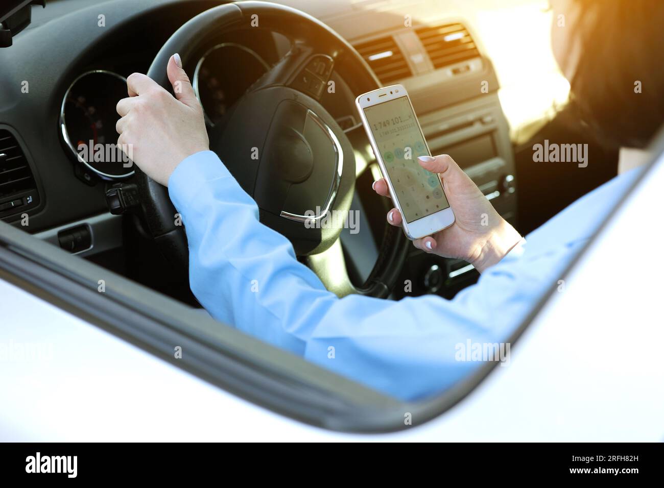 Unrecognisable businesswoman is using mobile smart phone calculator ...