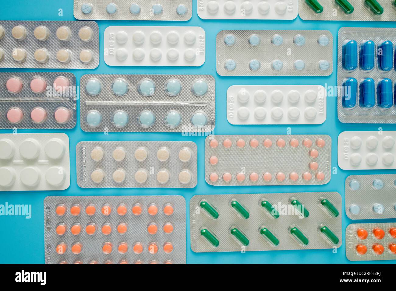 Colorful of tablets and capsules pill in blister packaging arranged ...