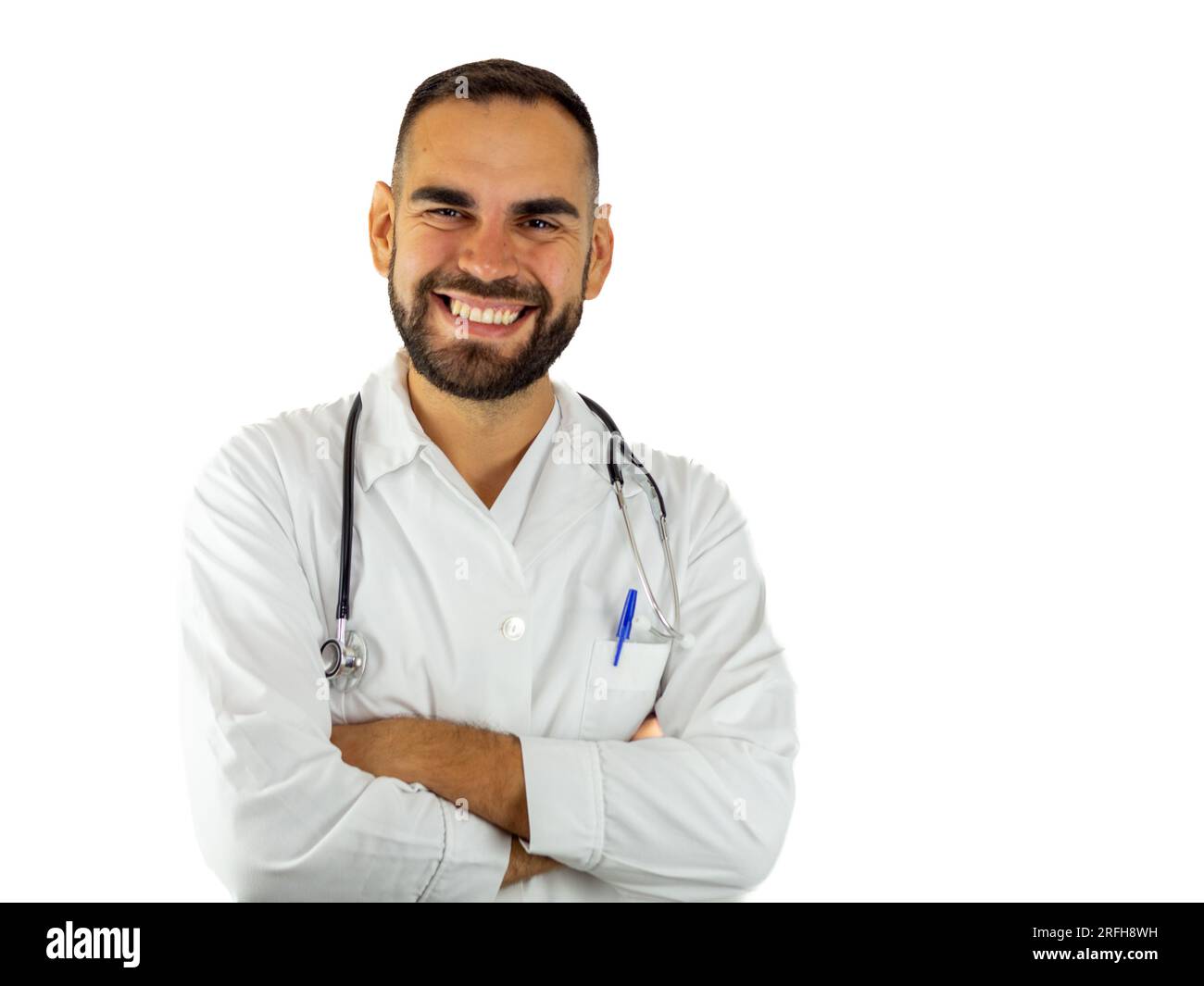Young male doctor crossing his arms while smiling. Looking at camera ...