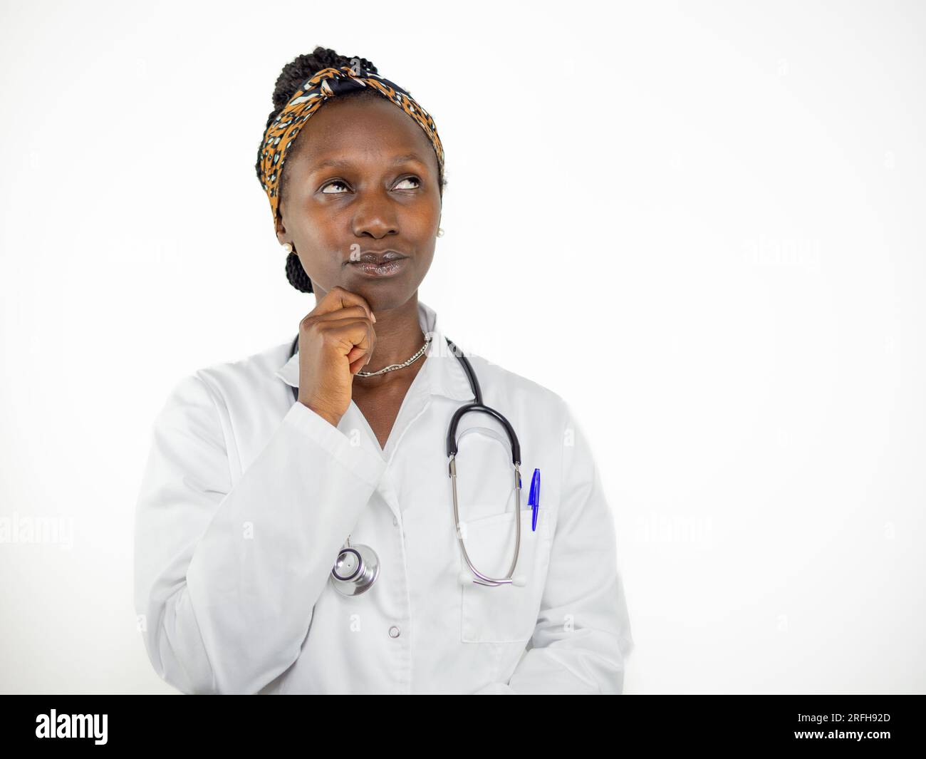 Young female doctor doubting. Isolated on white background Stock Photo ...