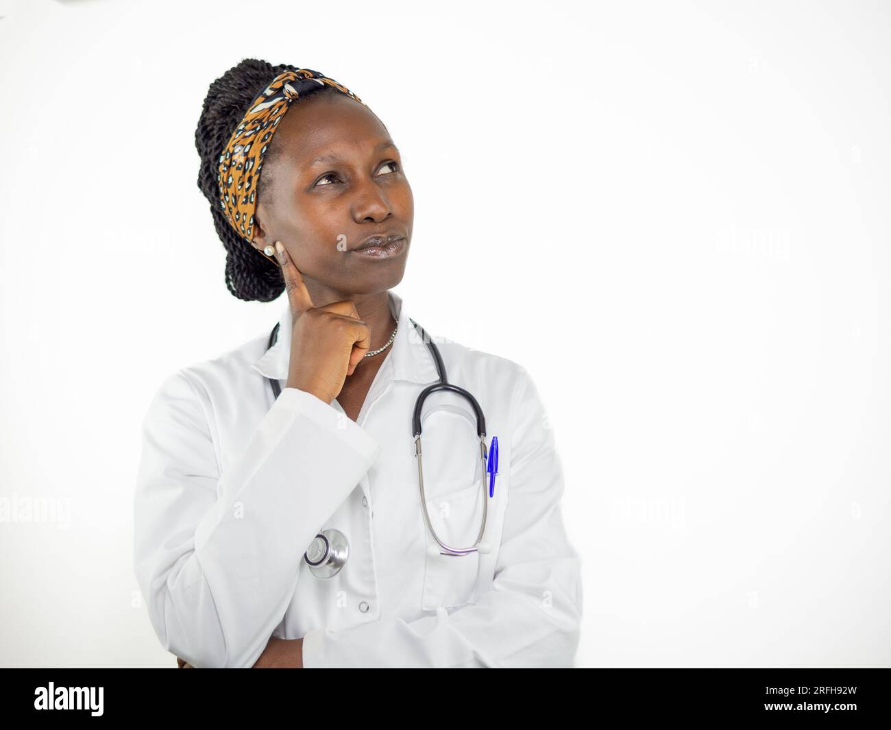 Young female doctor doubting. Isolated on white background Stock Photo ...