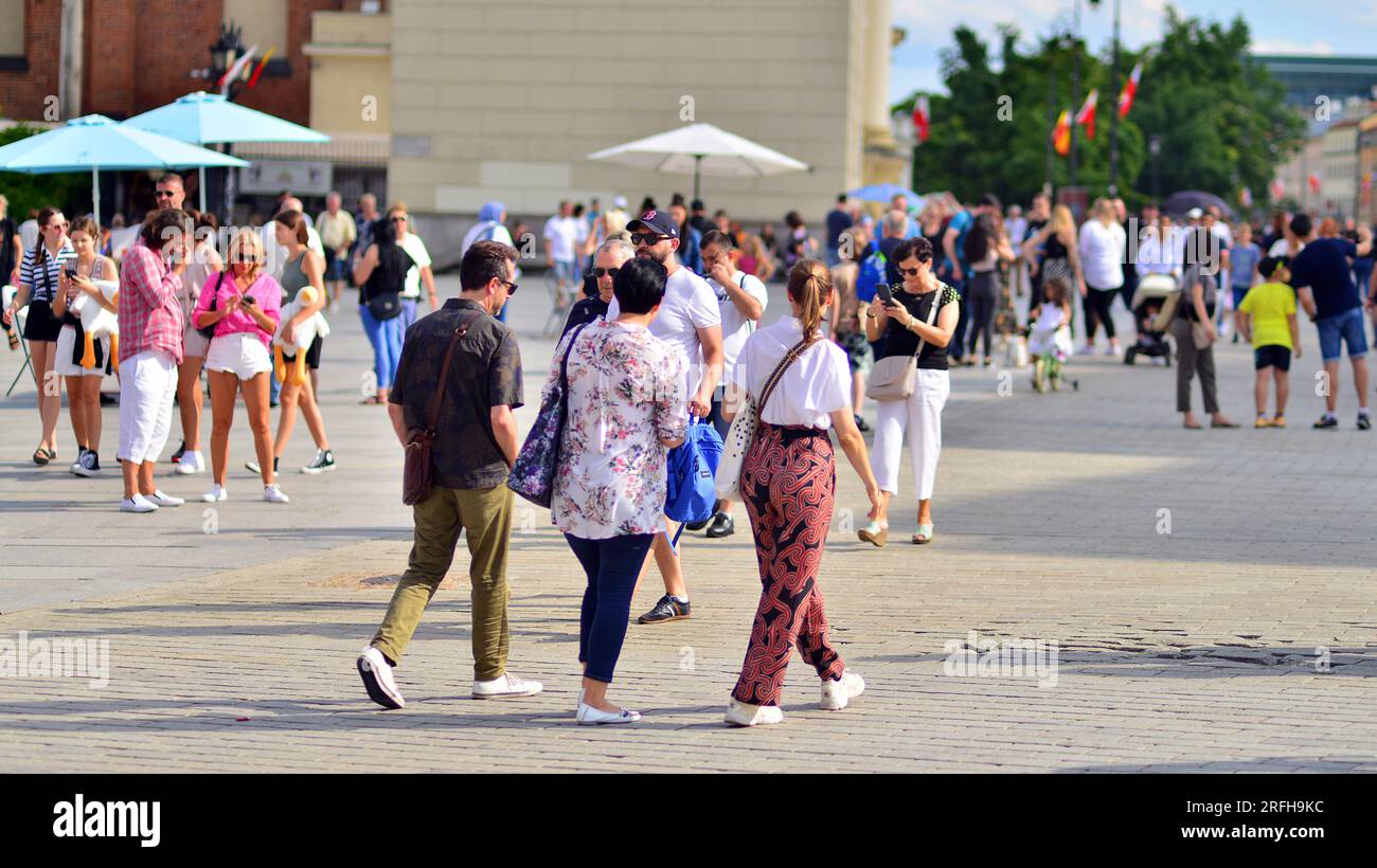 Warsaw, Poland. 29 July 2023. Crowd of people walking on a street. A ...