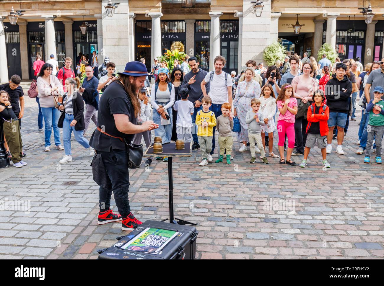 Australian magician Jason Maher performs and entertains a crowd in ...