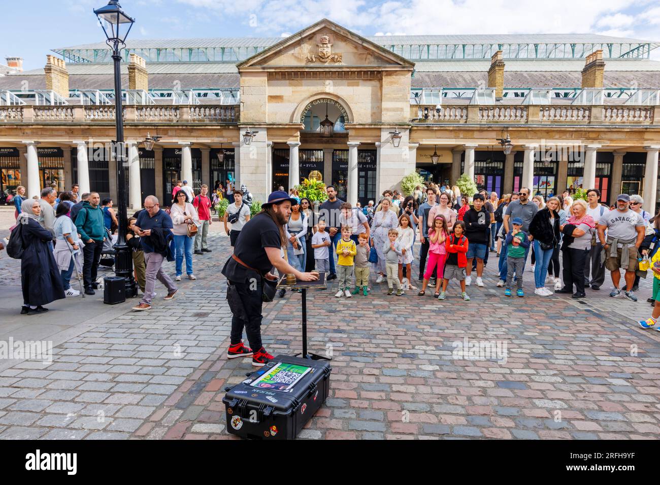 Australian magician Jason Maher performs and entertains a crowd in ...