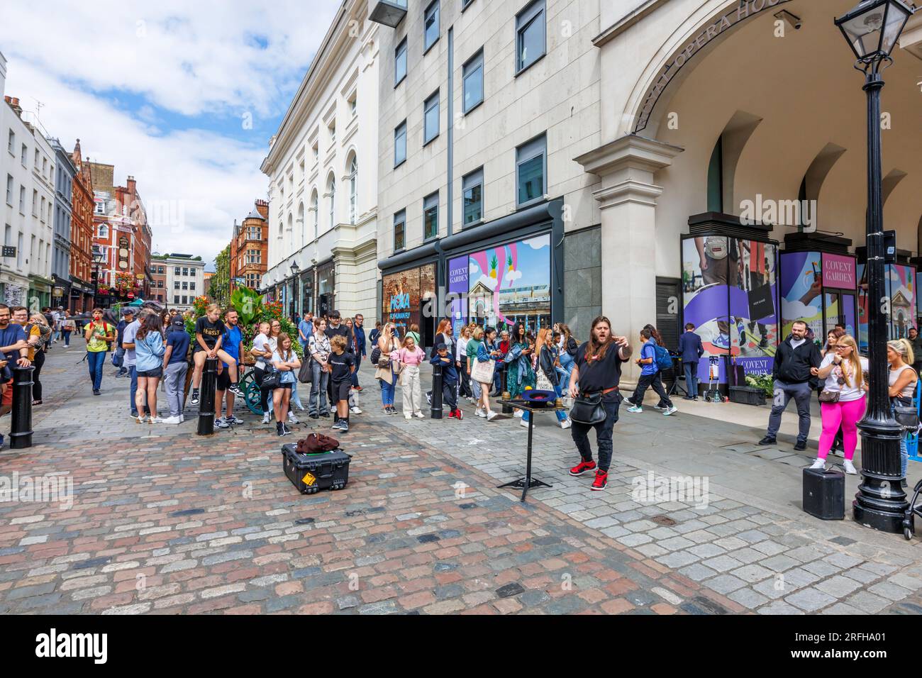 Australian street magician Jason Maher performs and entertains a crowd ...