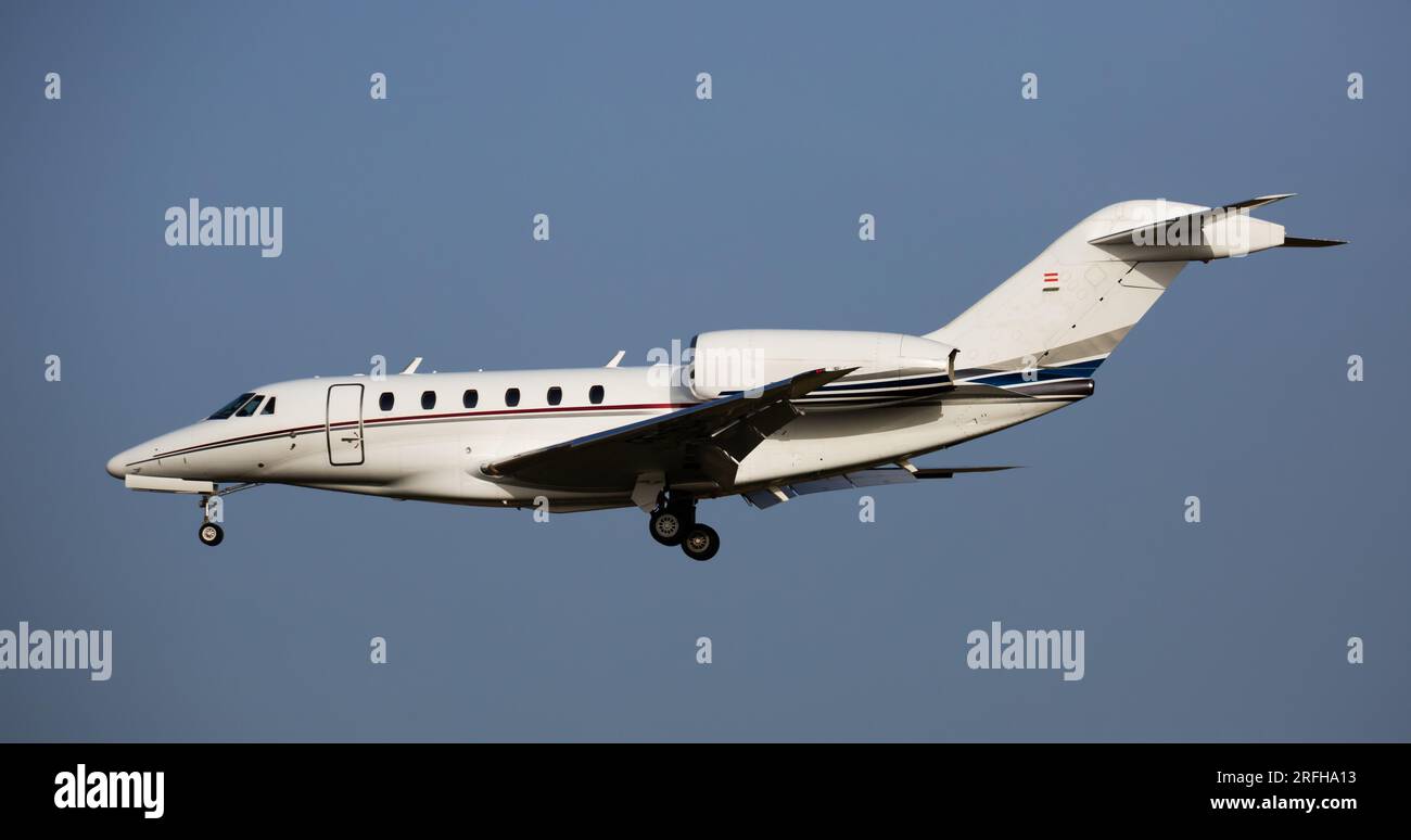 Light private jet comes in for a landing Stock Photo - Alamy