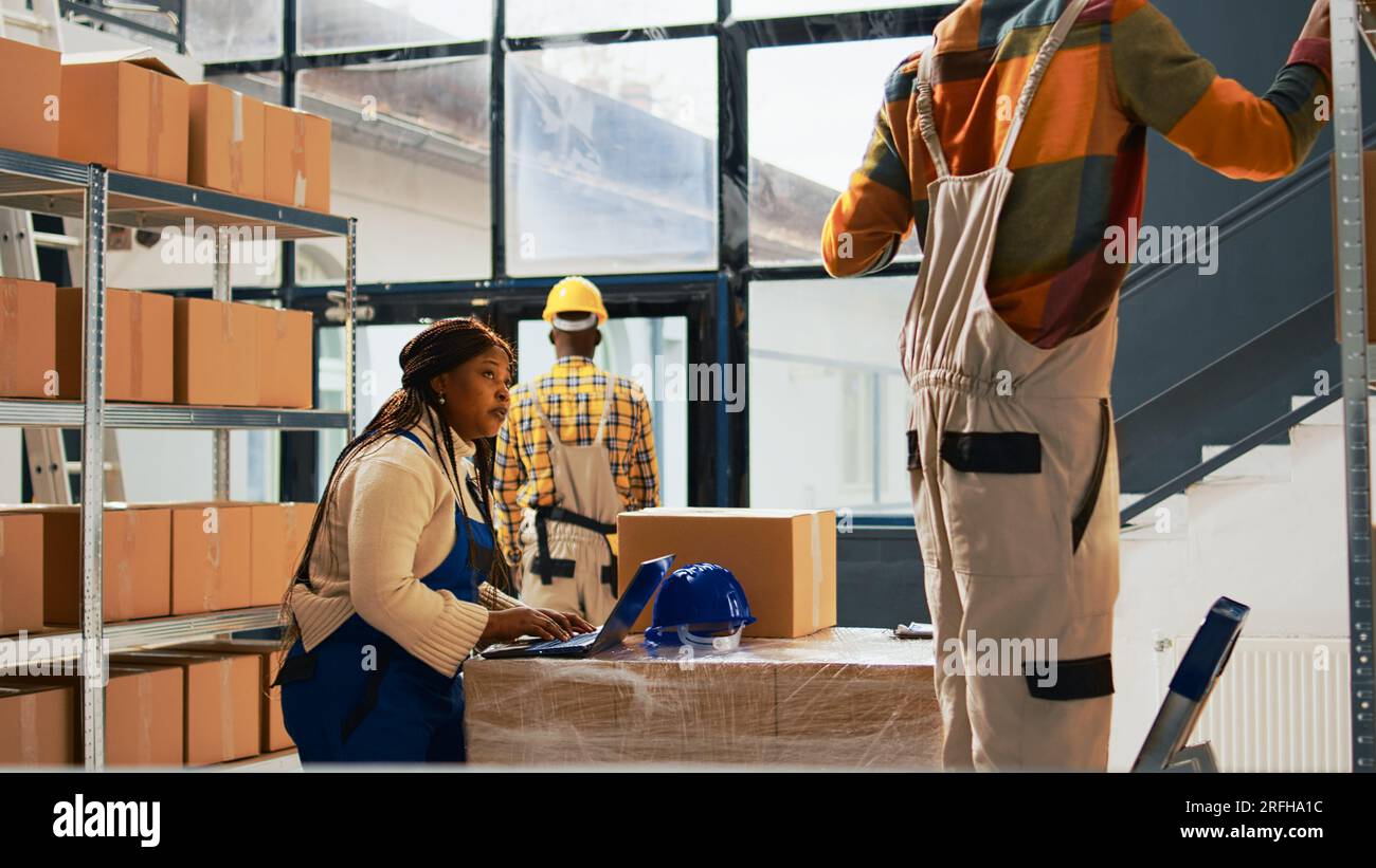 Team warehouse employees taking boxes hi-res stock photography and ...
