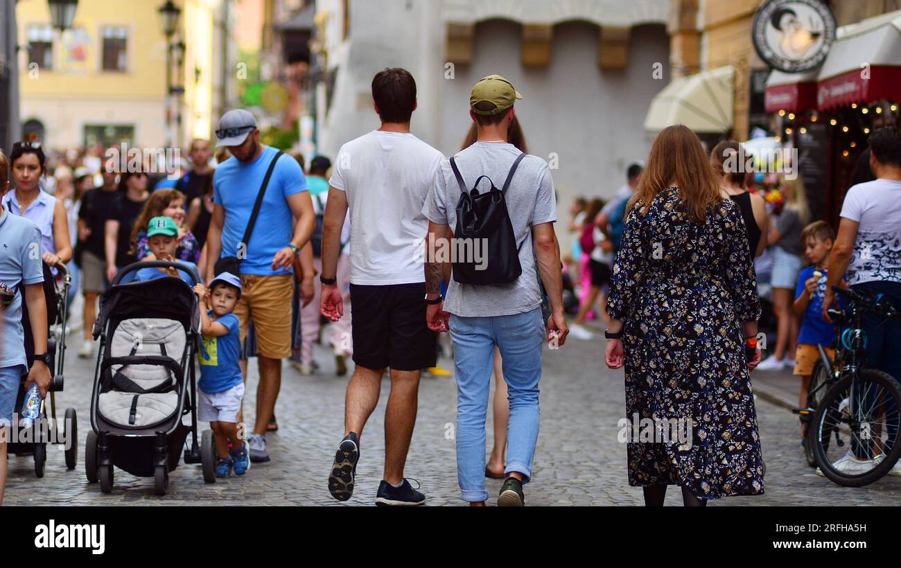 Warsaw, Poland. 29 July 2023. Crowd of people walking on a street. A ...