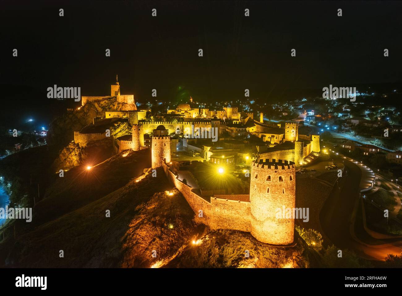 Drone aerial view of illuminated Rabat Fortress in Akhaltsikhe at night ...