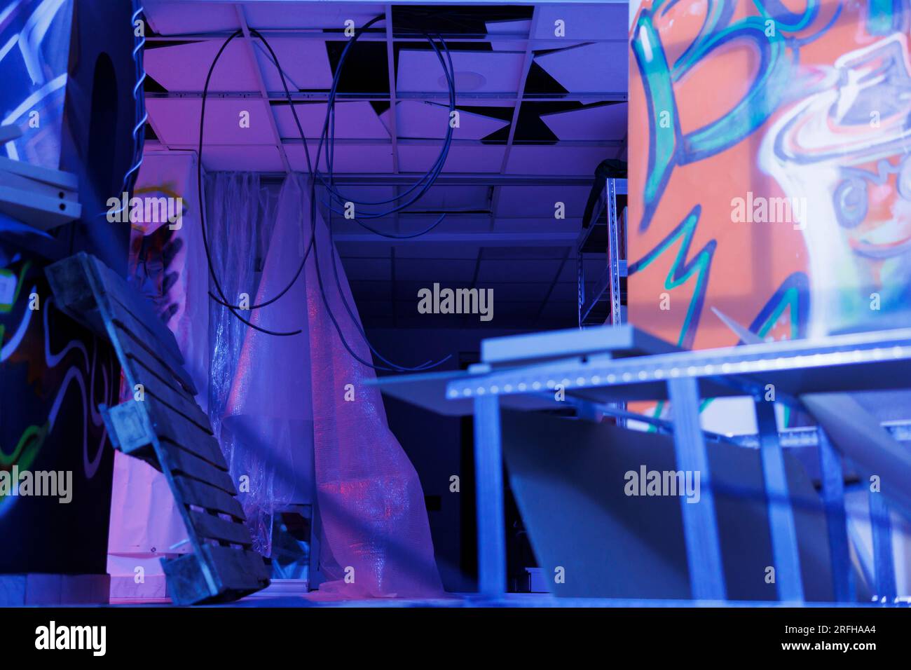 Destroyed old space with bright lights turned into ruin, deserted urban ...