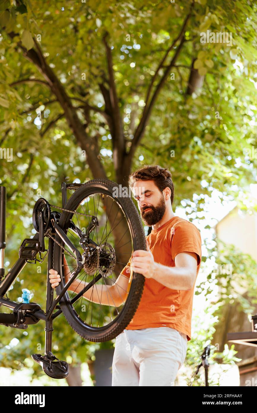 Image showing enthusiastic sporty caucasian man gripping and examining ...