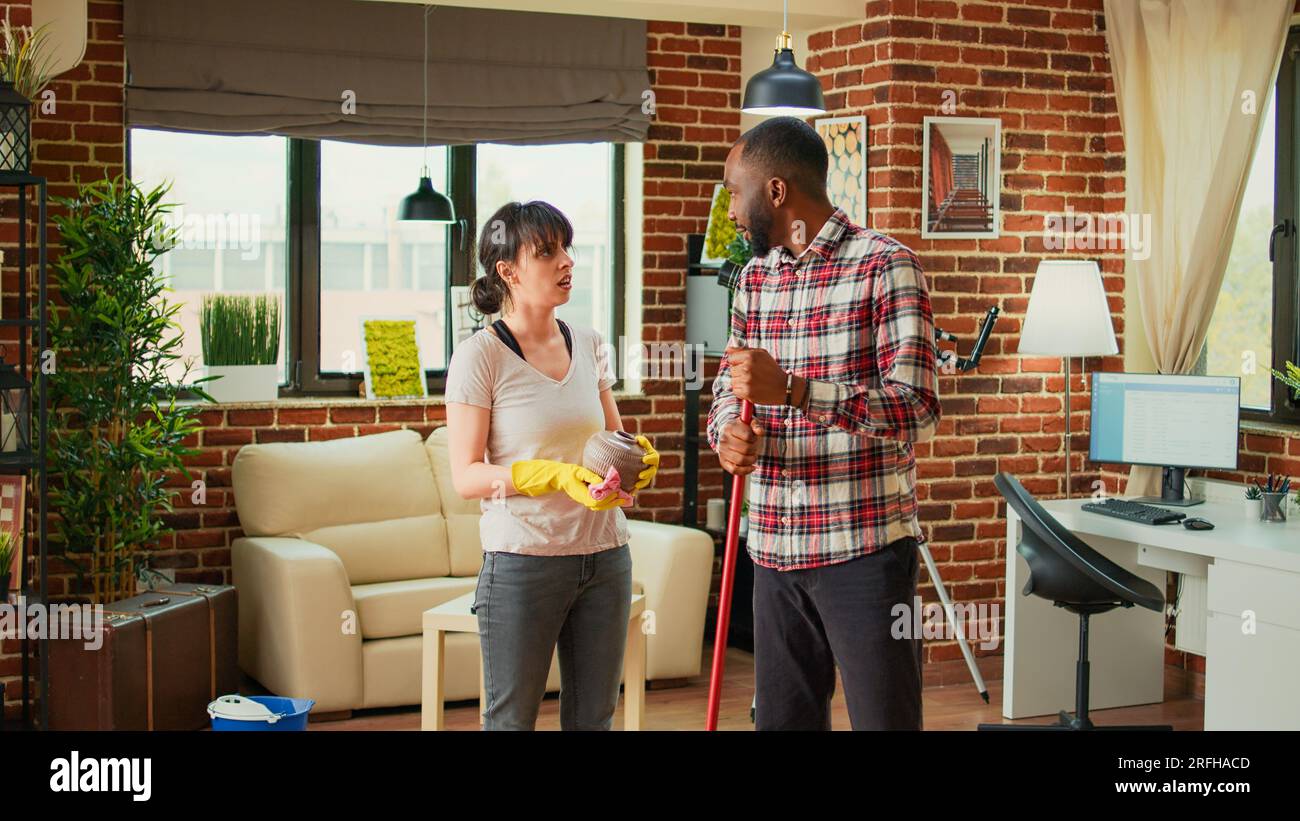 African american man vacuuming floors hi-res stock photography and ...