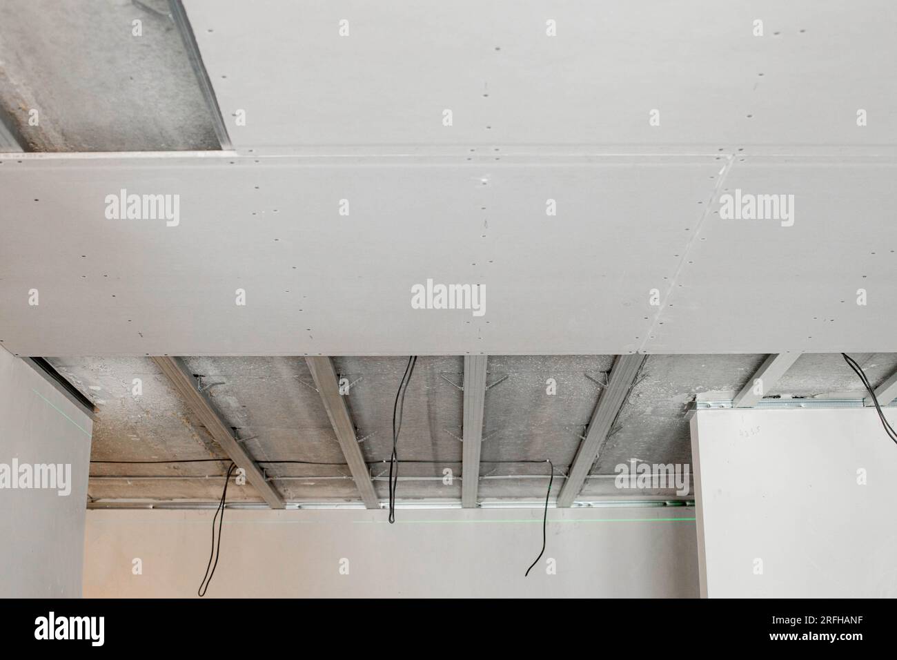 Structure with profiles and plasterboard for installation of suspended ...