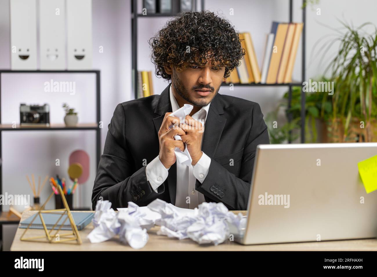 Angry furious indian man working at office throwing crumpled paper ...