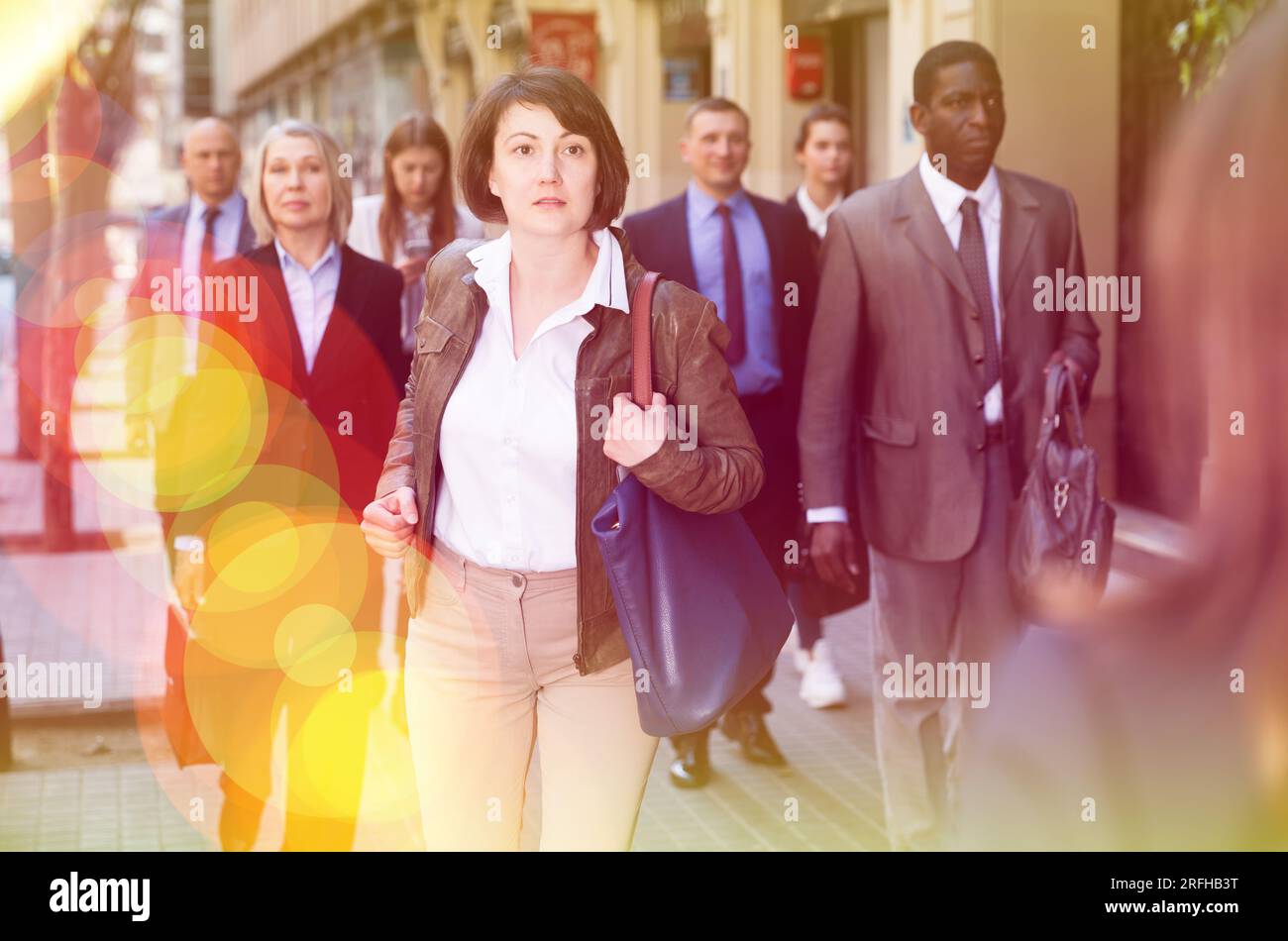 Hurrying woman walking on street Stock Photo - Alamy