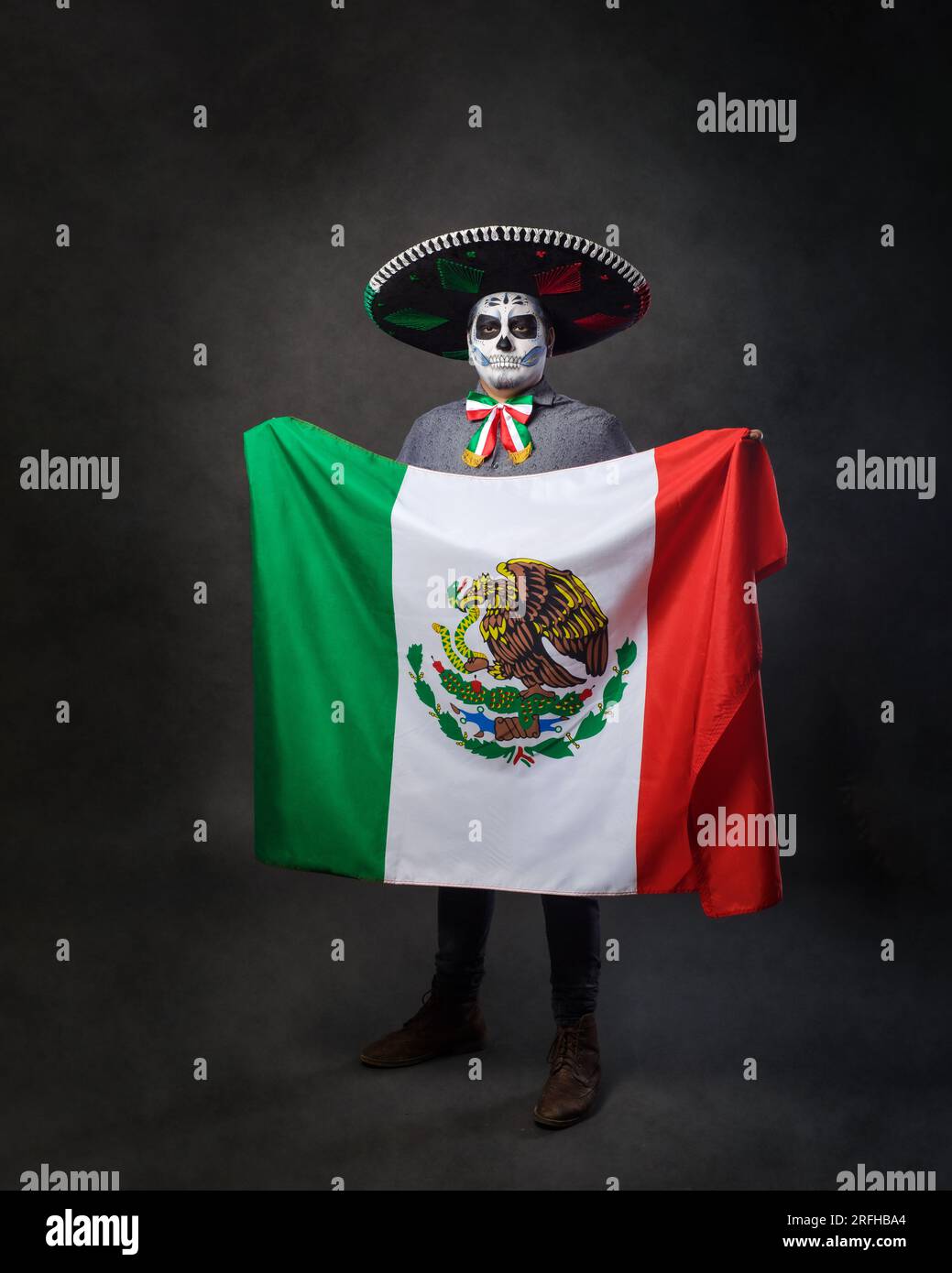 Portrait of catrin wearing charro hat and showing mexican flag. Day of ...