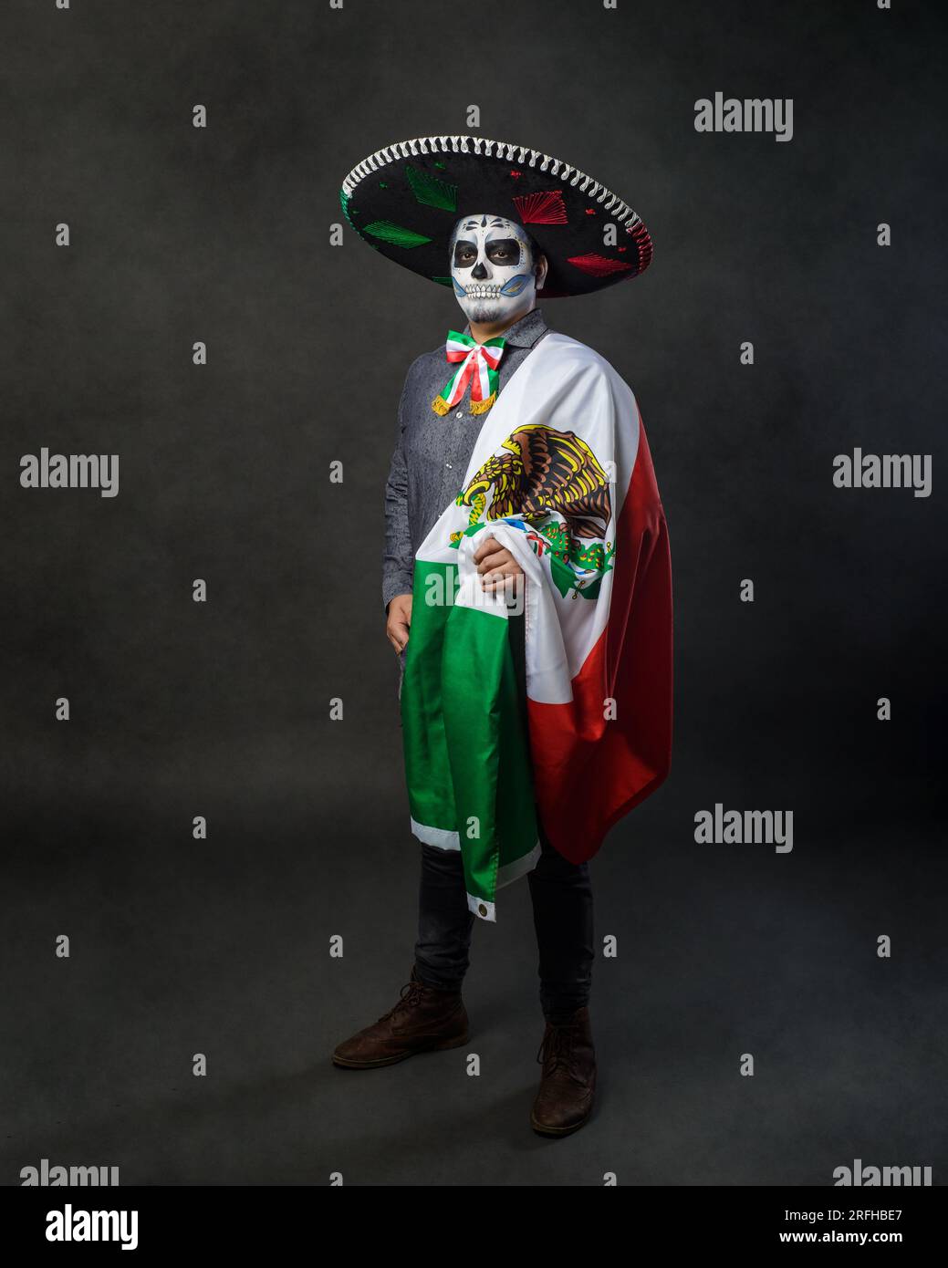 Portrait of catrin wearing charro hat and showing mexican flag. Day of ...