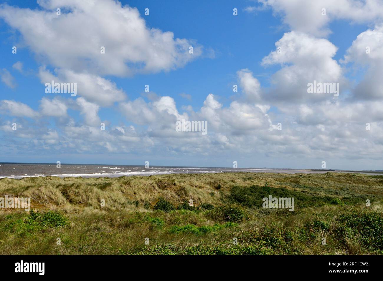 The north Norfolk beach at Thornham with sand dunes and salt marsh on a ...