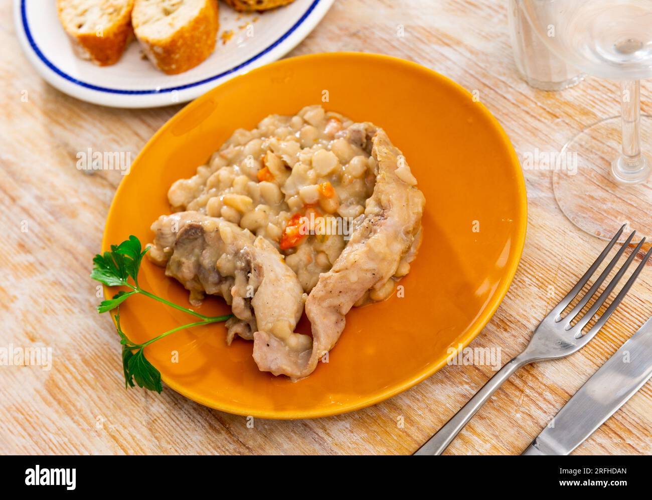 stewed rabbit with white beens Stock Photo - Alamy