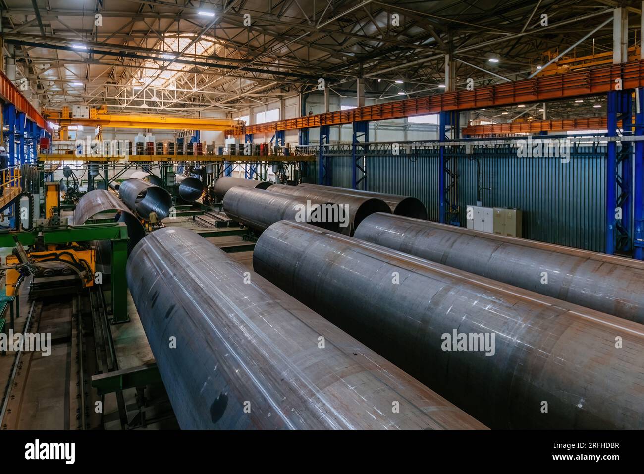 Modern seam pipe factory production line Stock Photo - Alamy