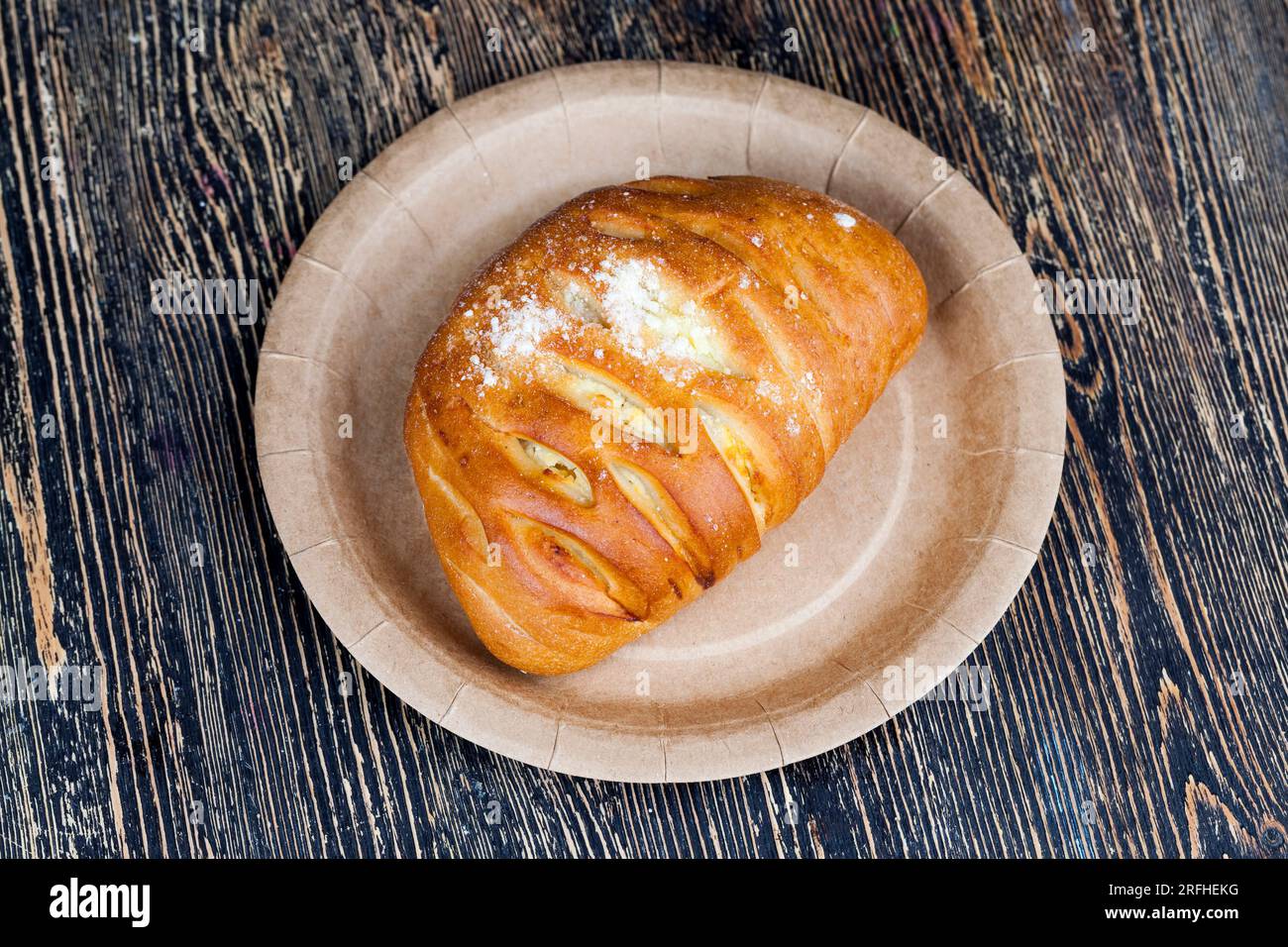 wheat bun with filling, white wheat flour buns on a cardboard plate ...