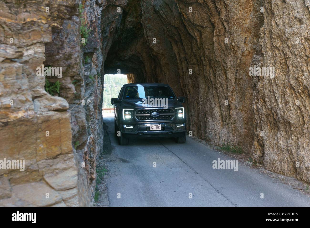 Truck going through Needles Eye tunnel in Needles Highway, Black Hills ...