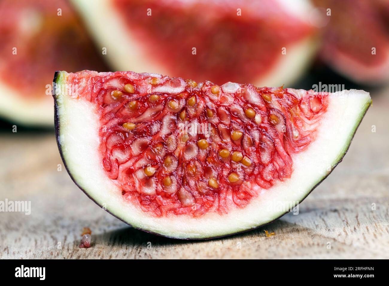 ripe figs cut into pieces, red fig pulp with lots of seeds, part of fig ...