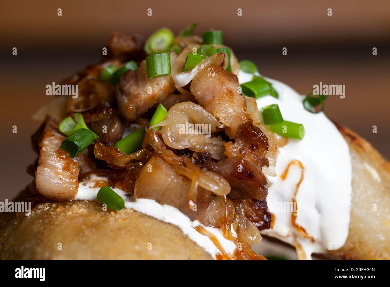 a traditional Lithuanian dish served with sour cream and fried bacon ...