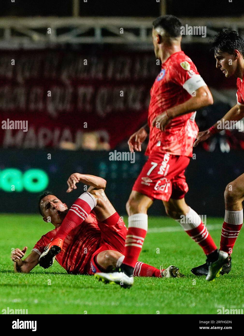 Luciano Sanchez of Argentina's Argentinos Juniors, left, grimaces after ...