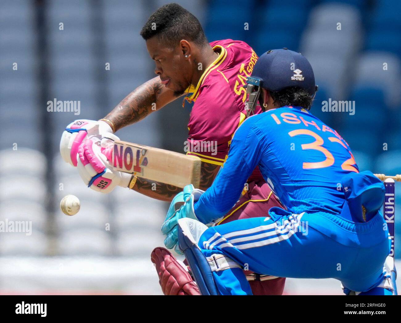 West Indies' Shimron Hetmyer plays a shot under the watch of India's ...