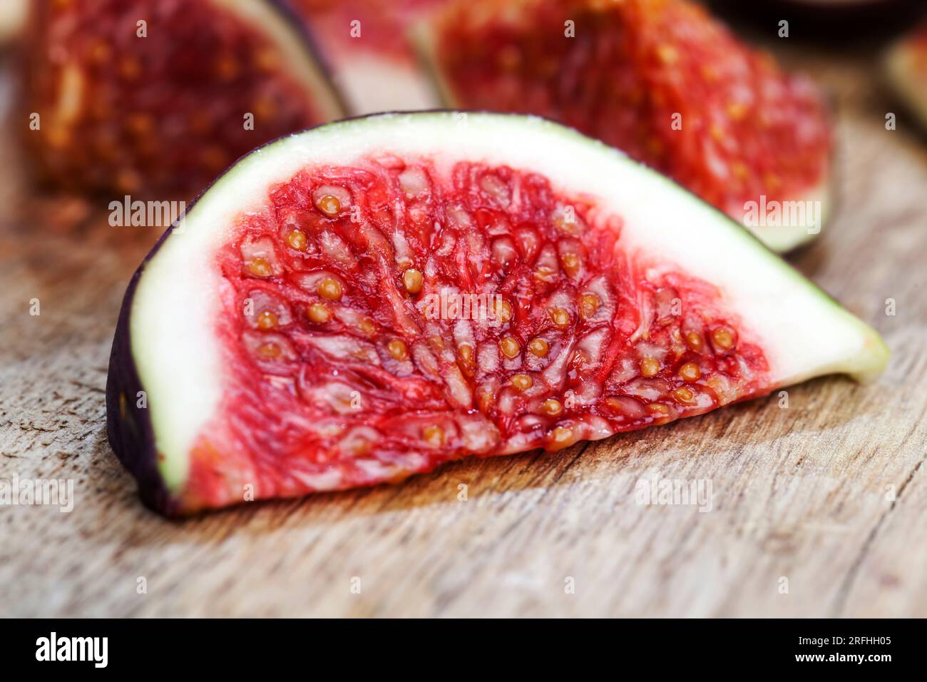 ripe figs cut into pieces, red fig pulp with lots of seeds, part of fig ...