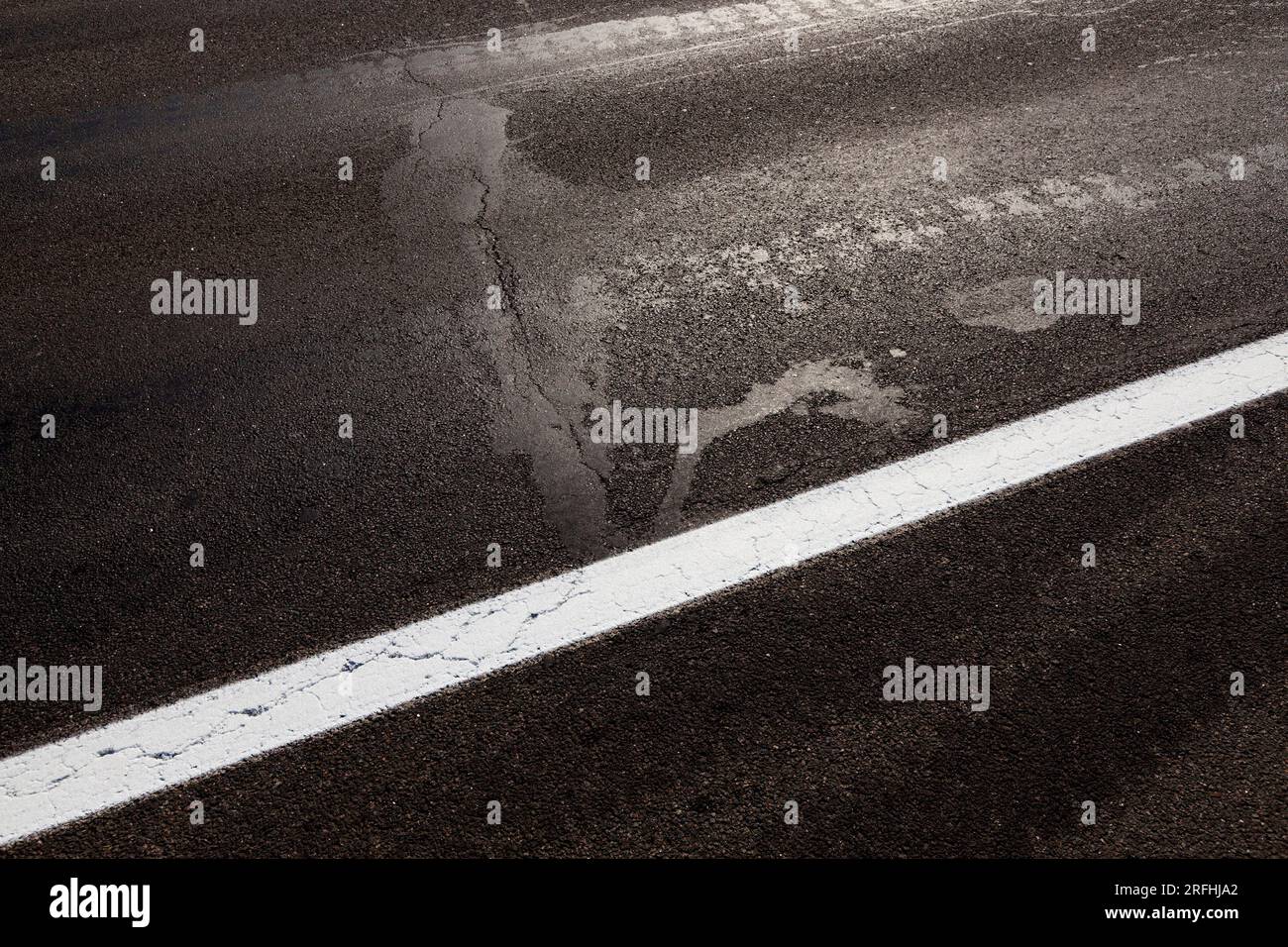paved road, a close up of a part of the carriageway of an asphalt road ...