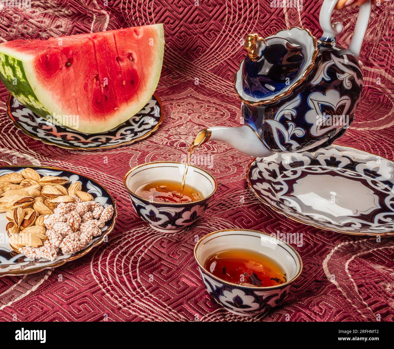 traditional uzbek tea with nuts and watermelon Stock Photo - Alamy