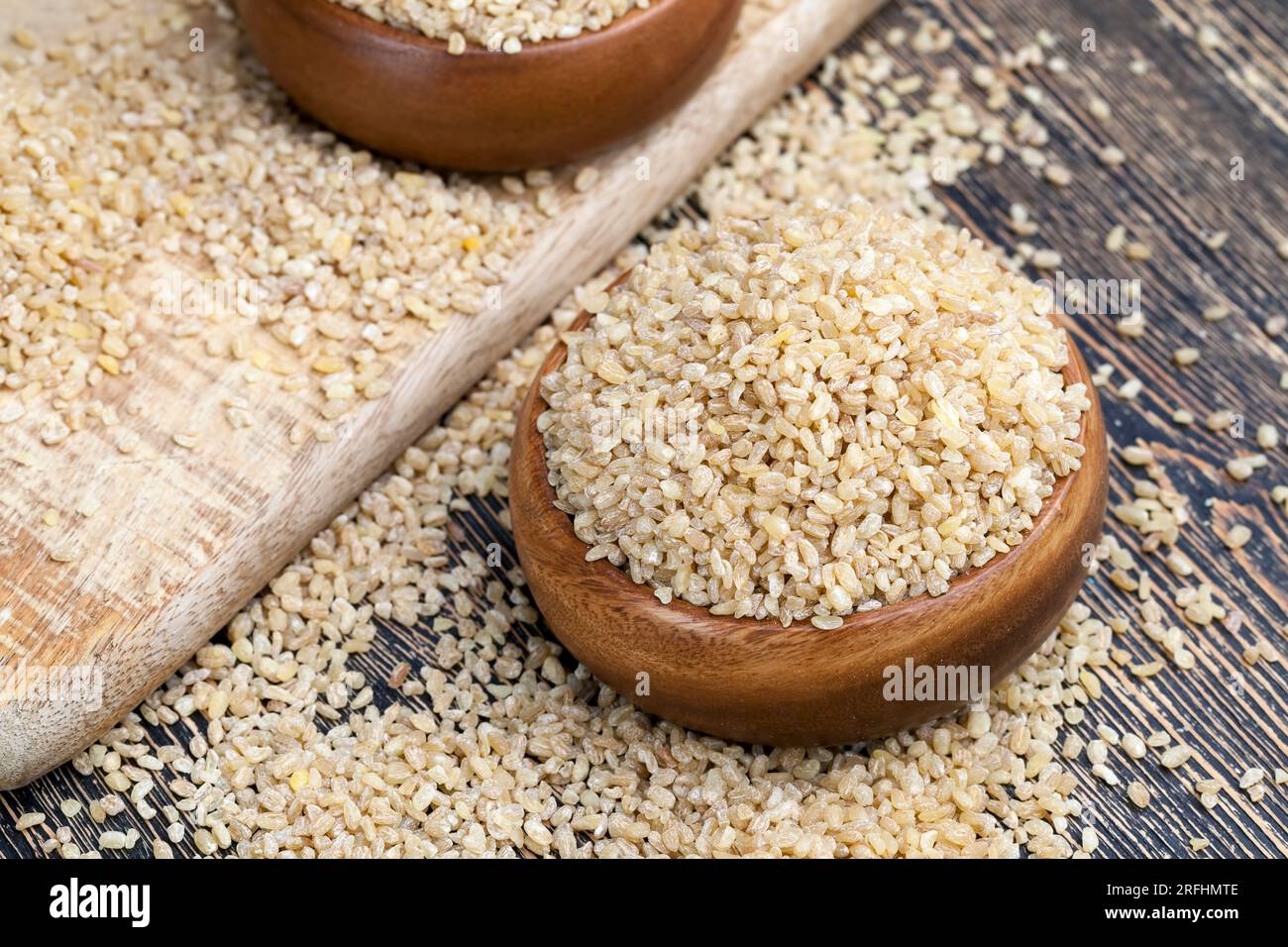 raw bulgur porridge that is not cooking, large amount of cereals on a ...