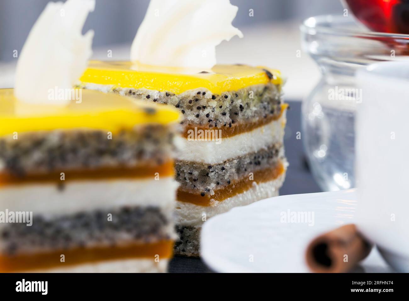 multi layered sponge cake with poppy seeds, mango fruit filling and ...