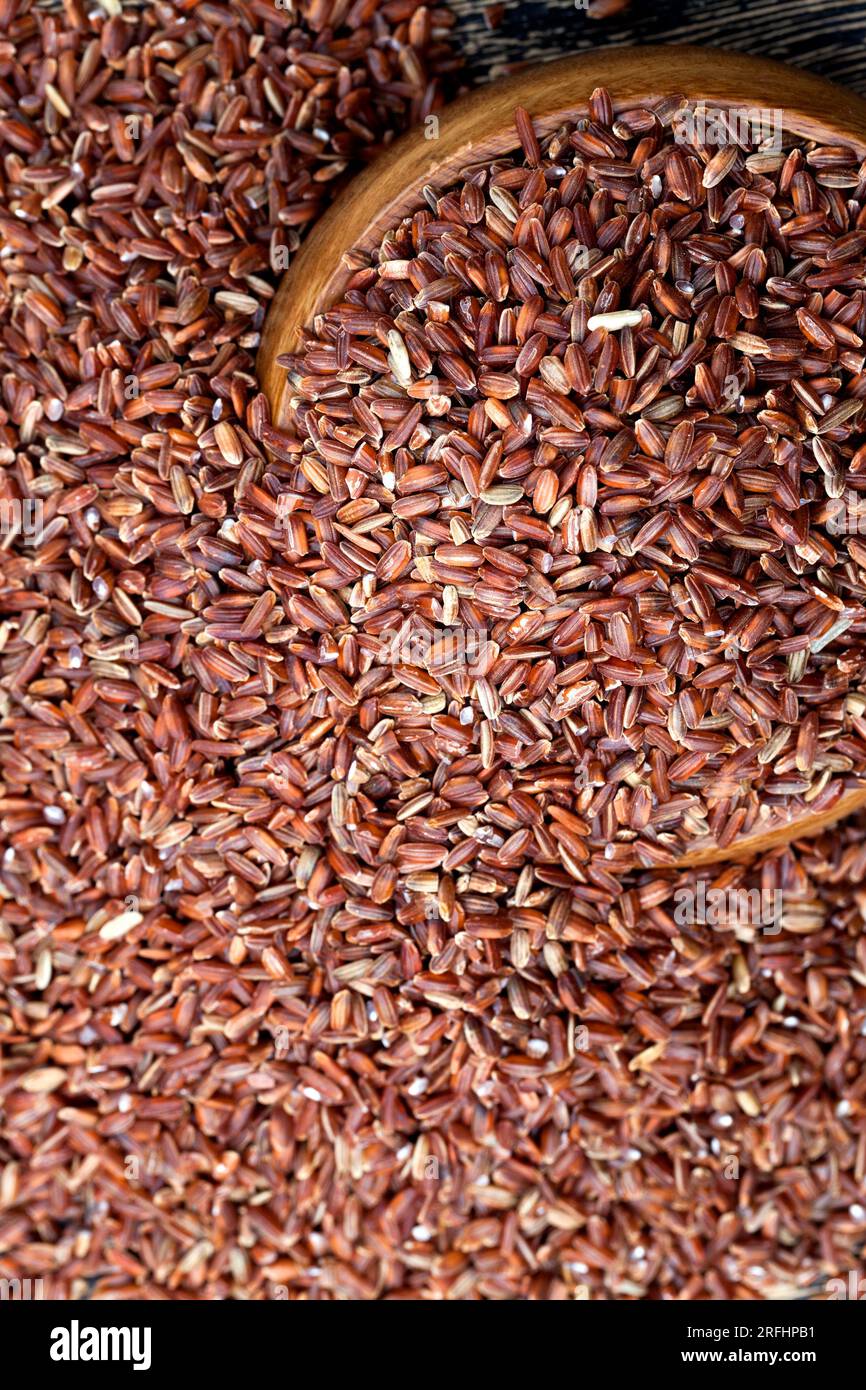 red ripe rice, raw uncooked red rice, unpeeled to preserve the ...